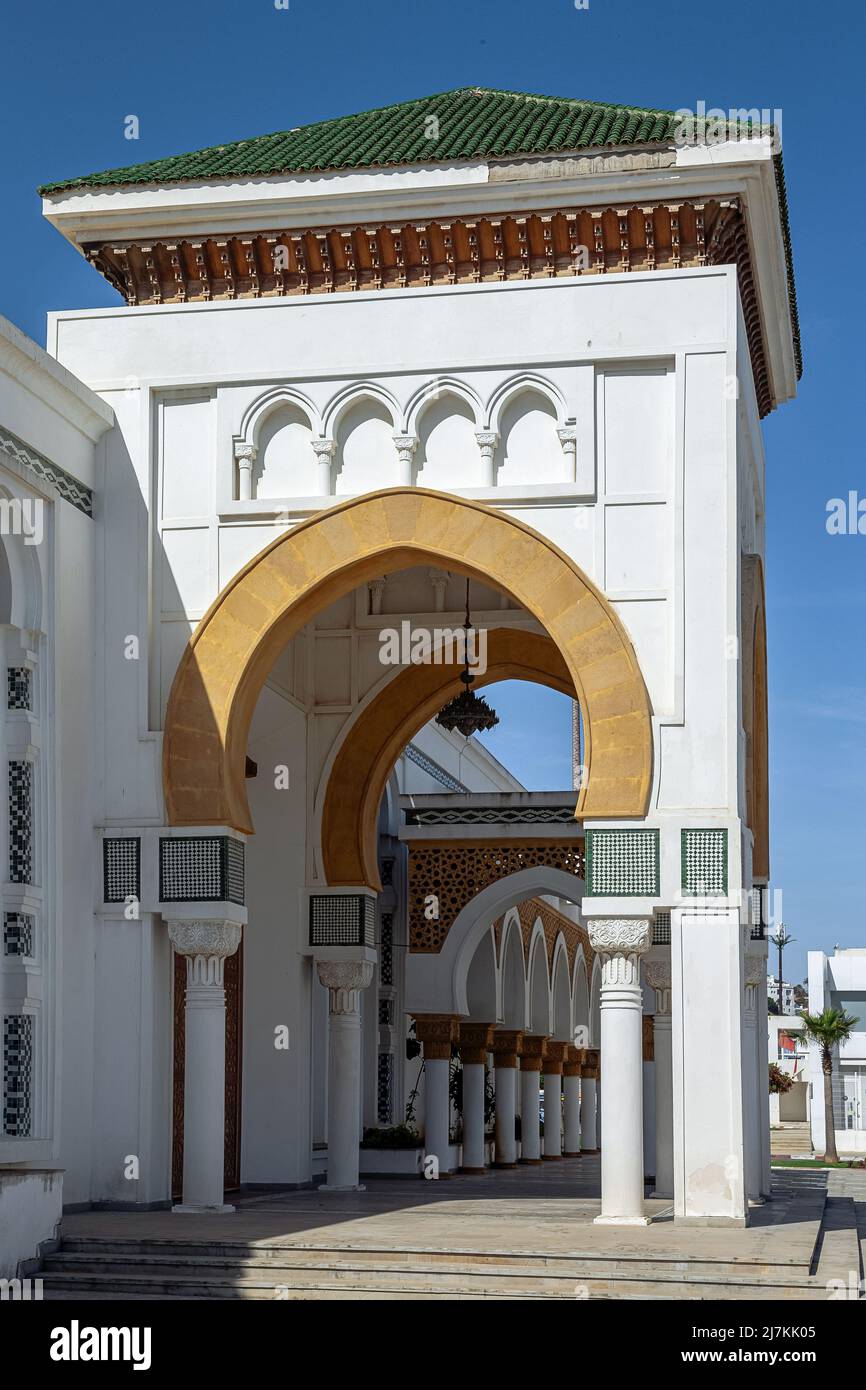 Exterior of historic Muslim mosque with arched passages and closed ...