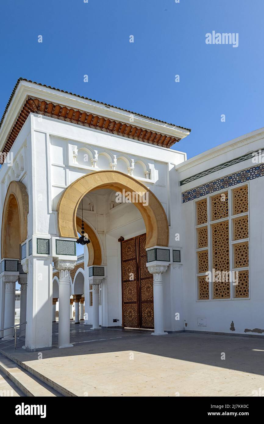 Exterior of historic Muslim mosque with arched passages and closed ...
