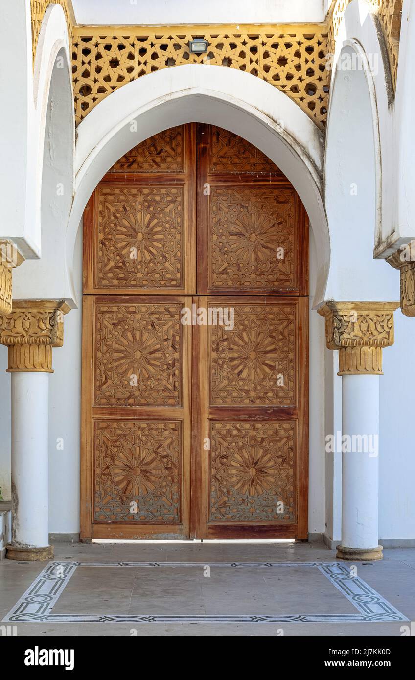 Closed entrance door with ornamental elements of traditional mosque ...