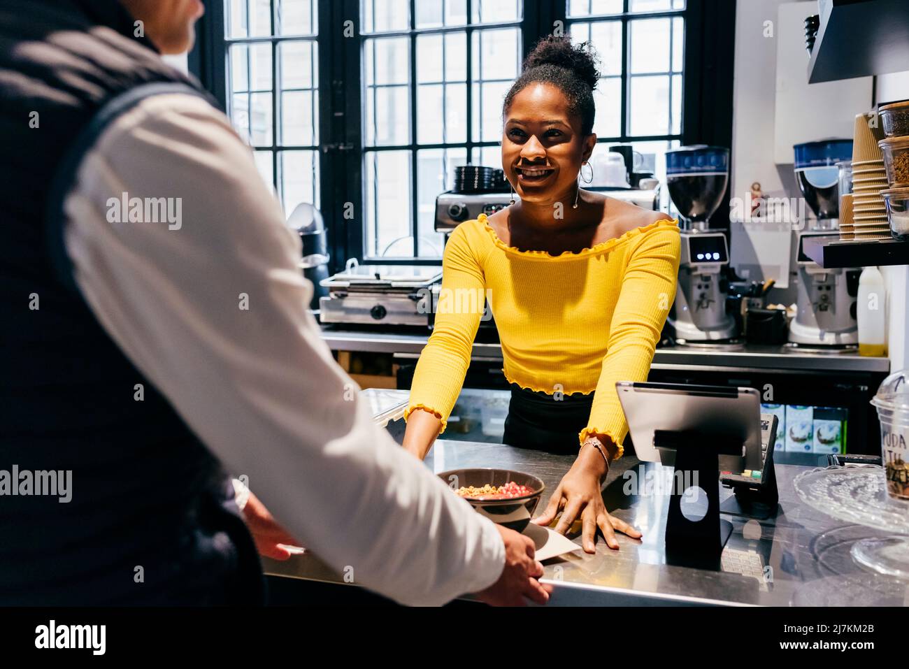 From above shot of anonymous lady holding toe while doing yoga on ...