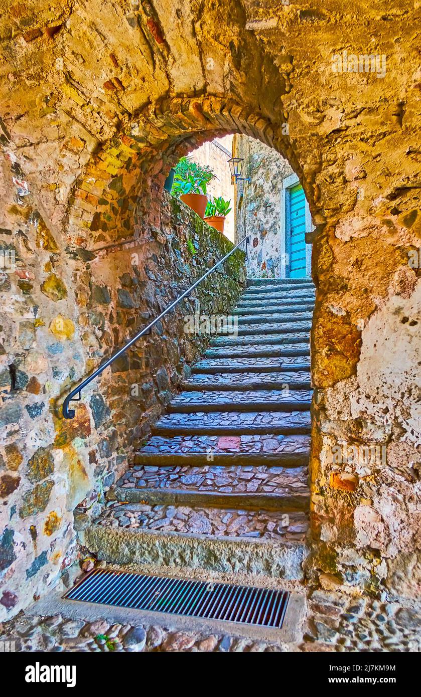 The narrow old pass under the medieval stone house, Morcote ...