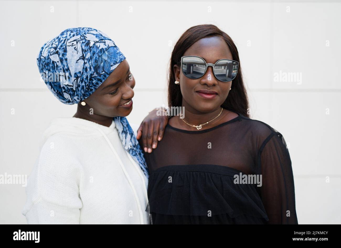 Positive young African American female best friends in casual outfits ...