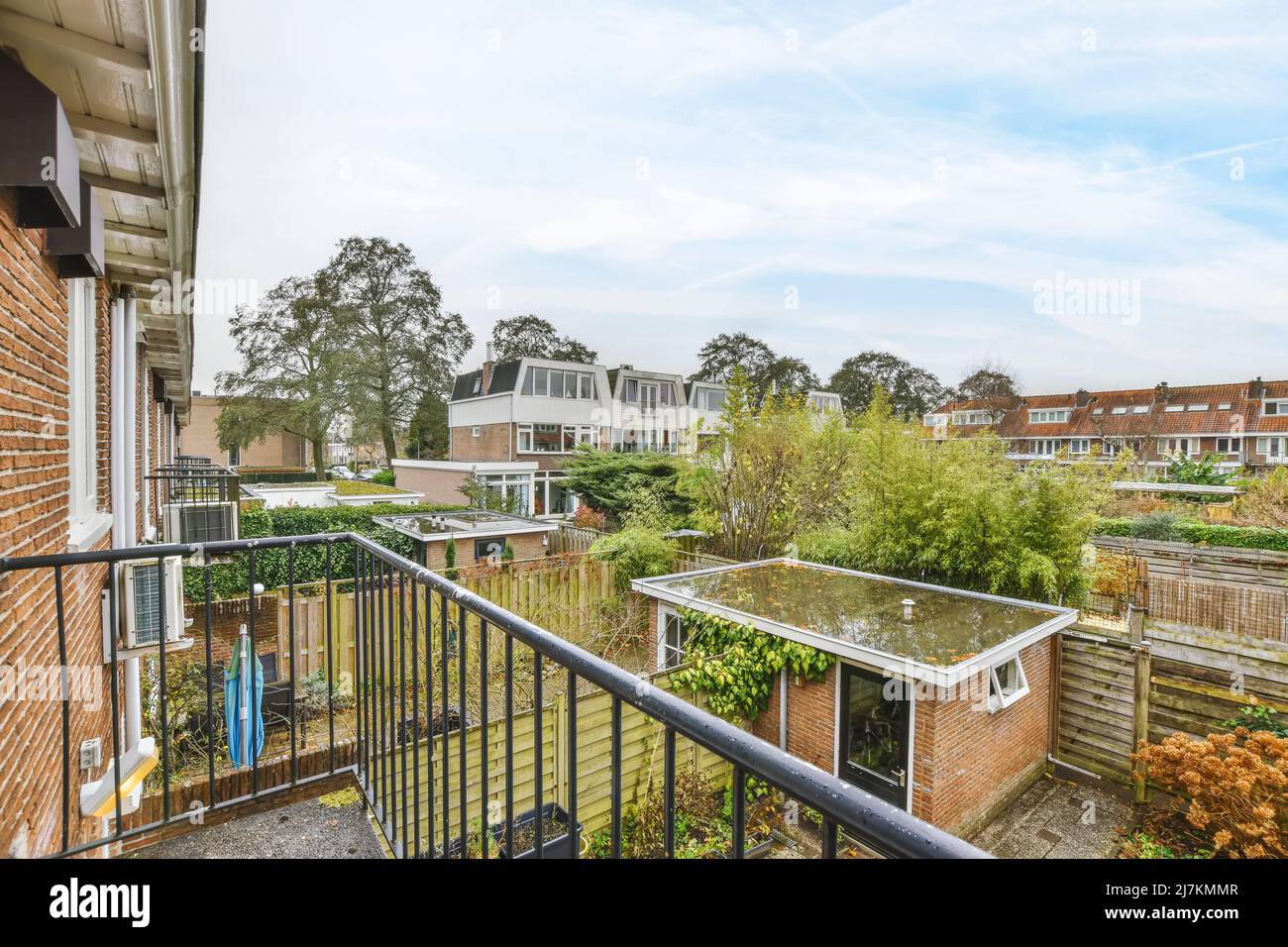 Balcony with metal fence of residential building located in suburb area ...