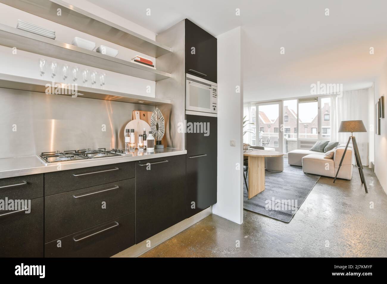 Kitchen counter with black cabinets and modern appliances with ...