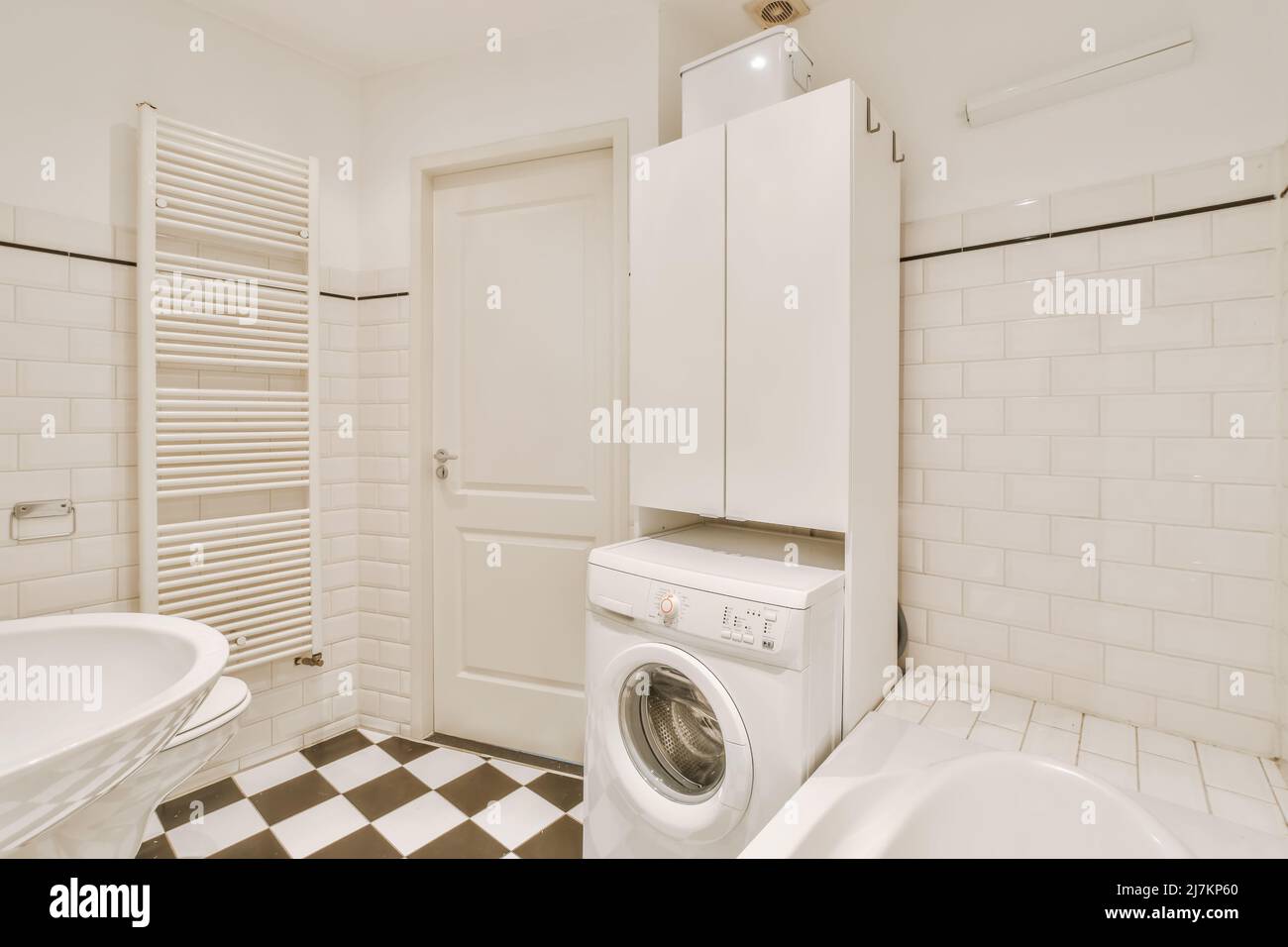 Interior of contemporary bathroom with basin near cupboard on white ...