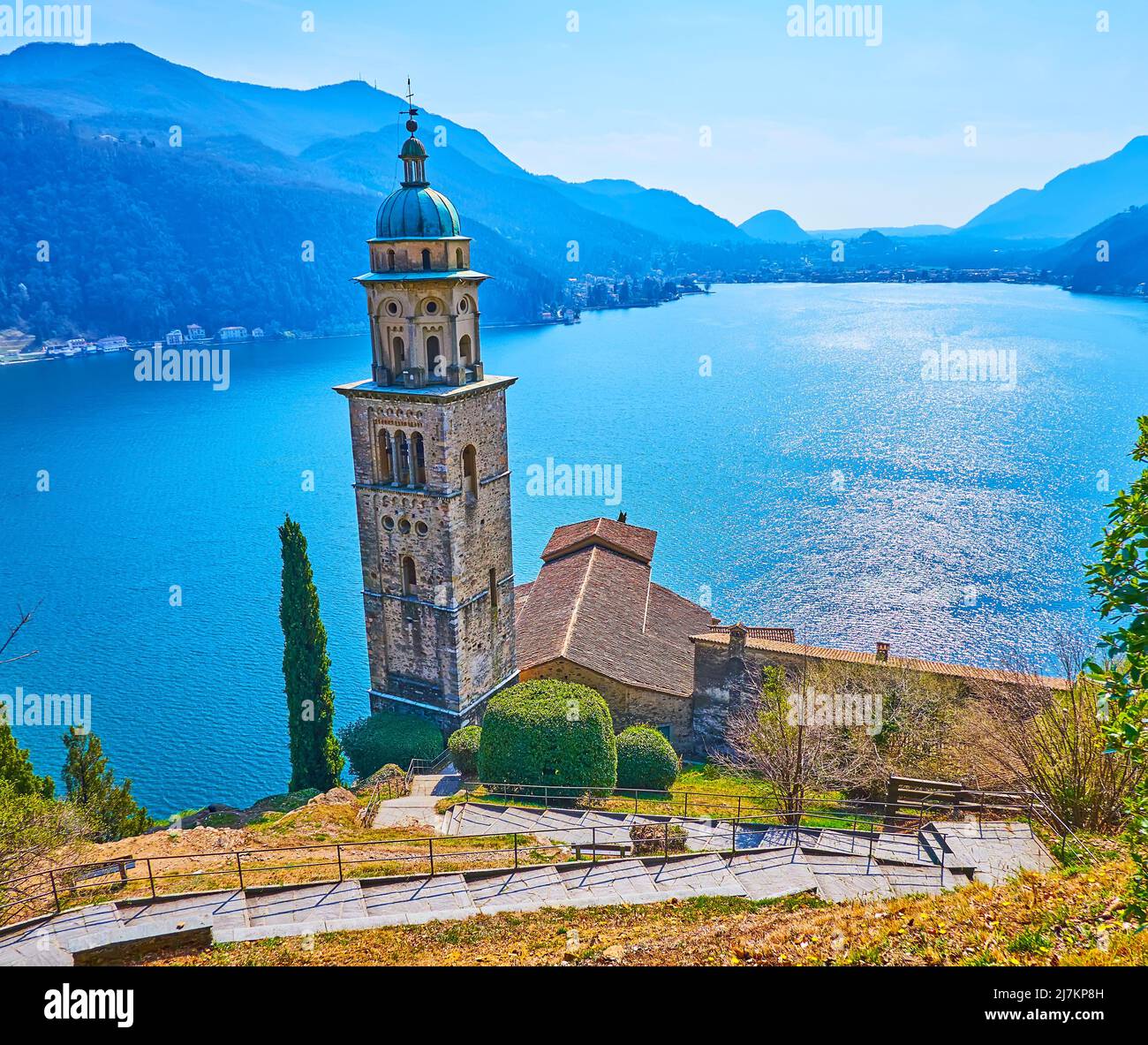 The slender stone bell tower of Santa Maria del Sasso Church against ...