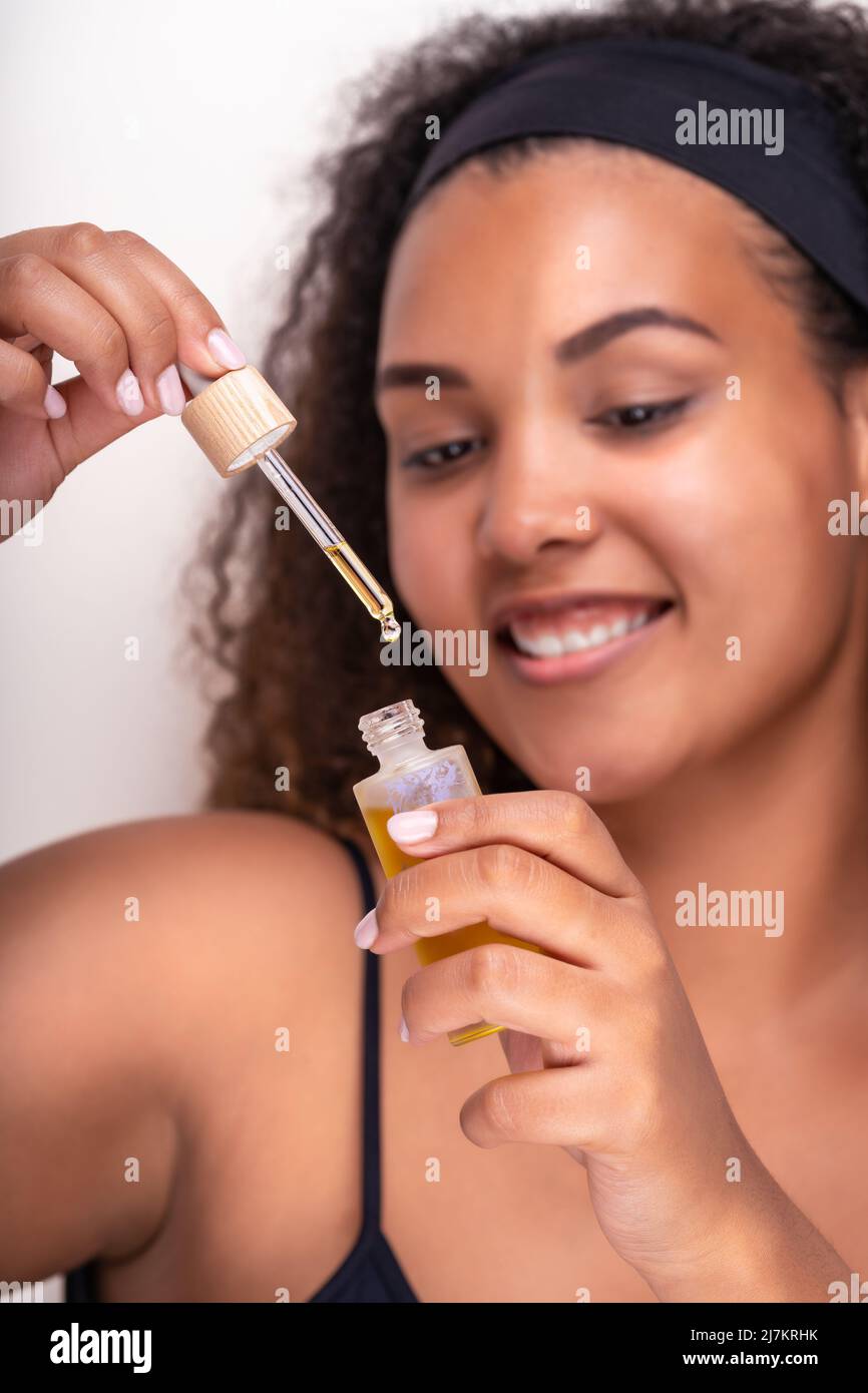 Gorgeous smiling young Hispanic female model with perfect skin and long ...