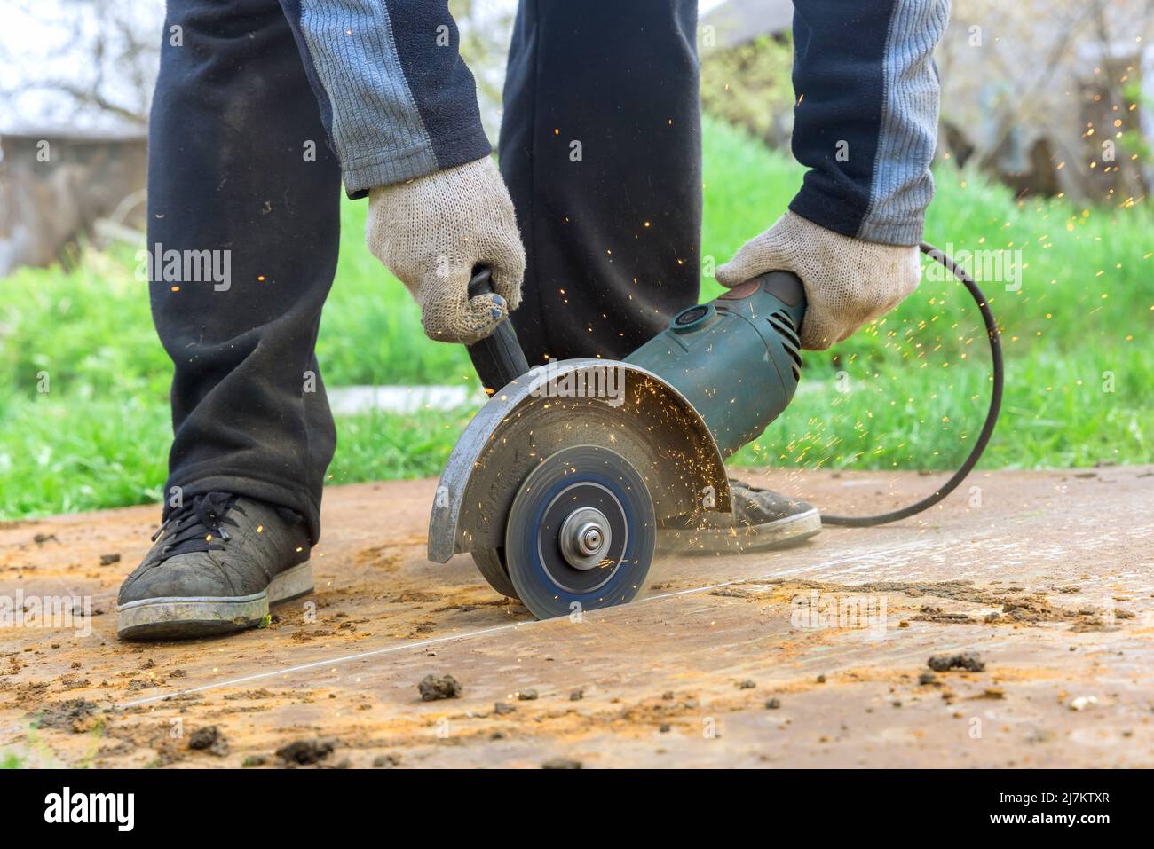 Worker hands cutting a metal sheet Stock Photo - Alamy