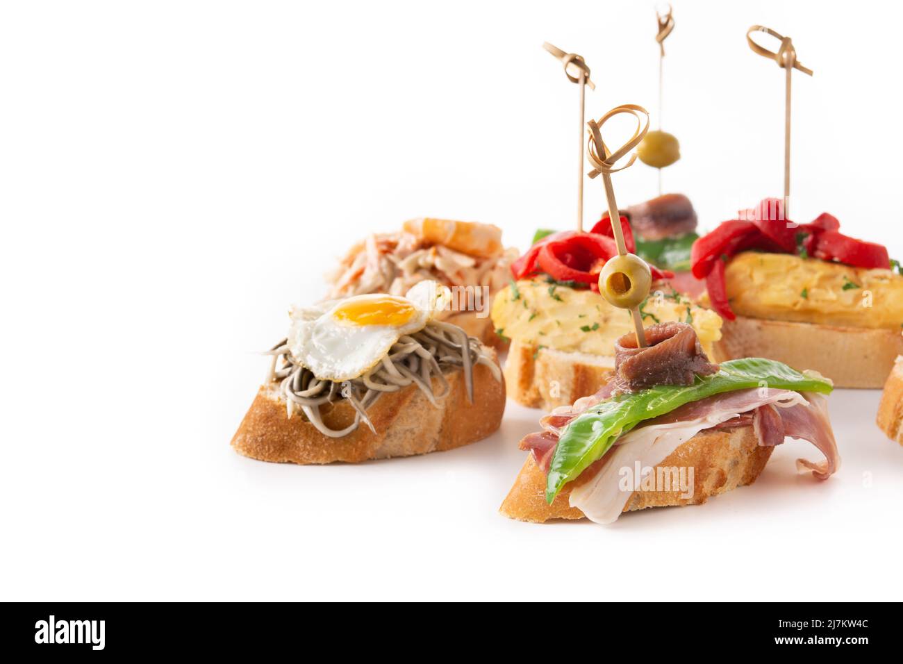 Assortment of Spanish pintxos isolated on white background Stock Photo ...
