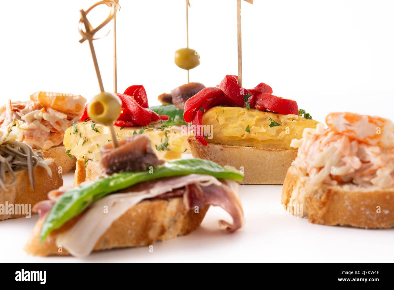 Assortment of Spanish pintxos isolated on white background Stock Photo ...