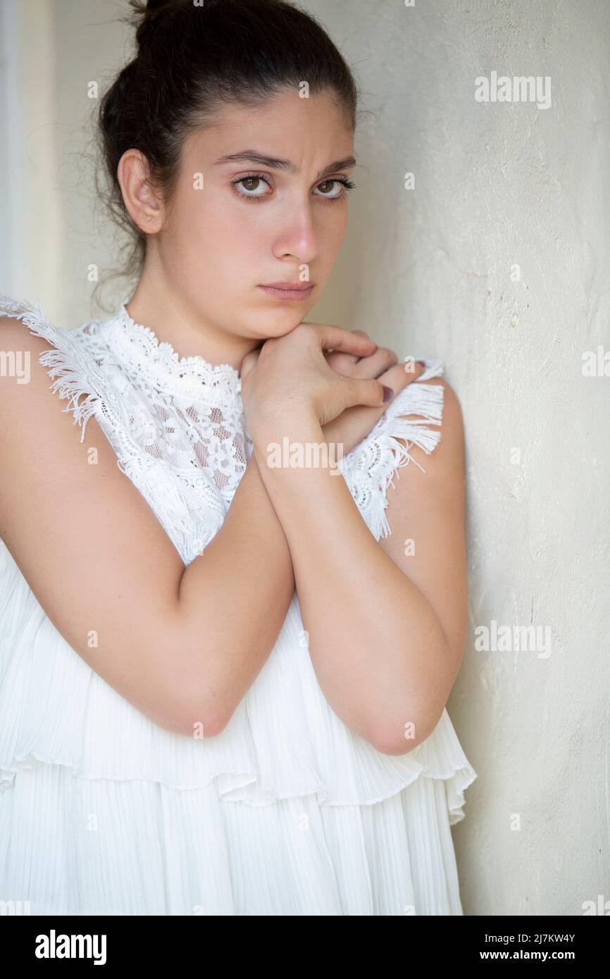 Sad beautiful woman standing indoors Stock Photo - Alamy