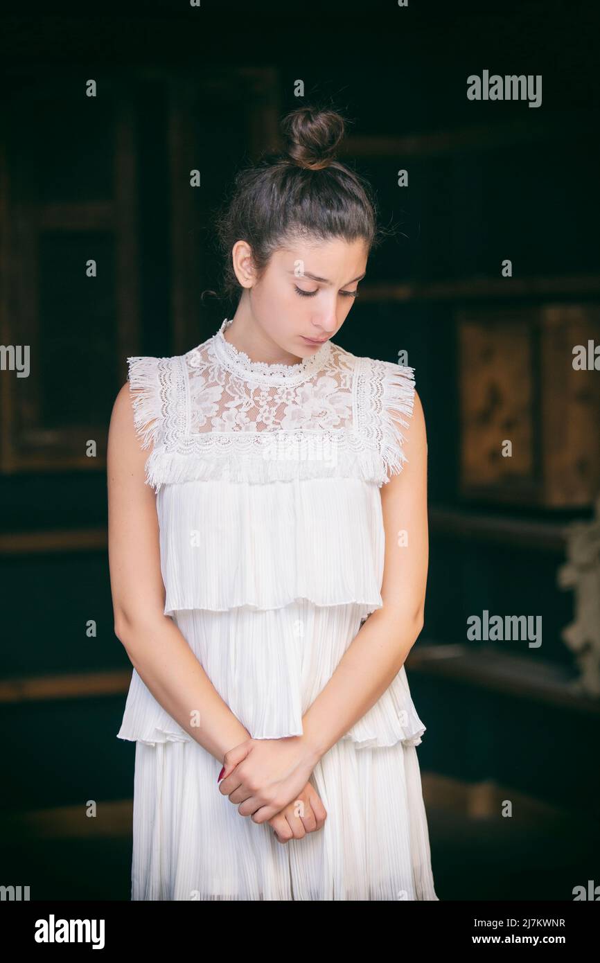 Sad woman looking down Stock Photo - Alamy