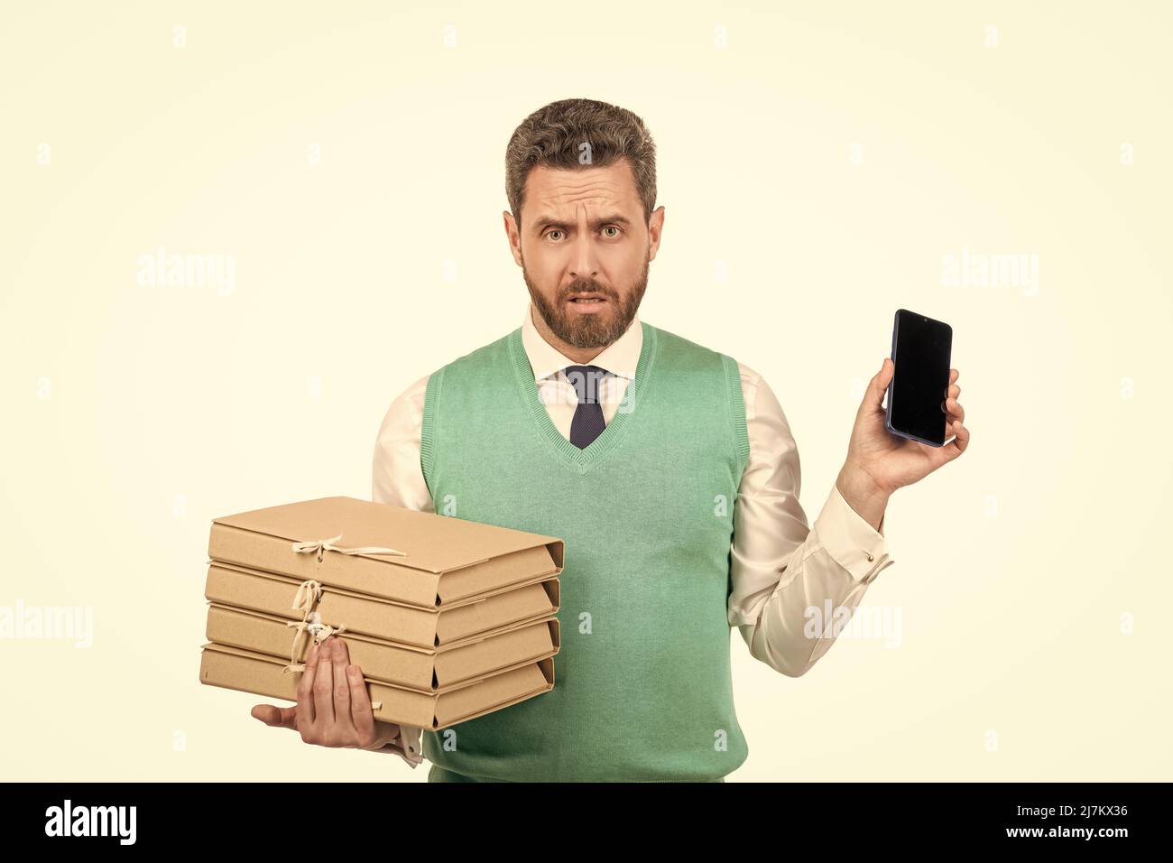 confused business guy hold folders with documents showing phone screen ...