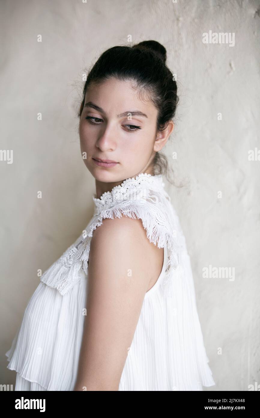 Sad woman looking over shoulder Stock Photo - Alamy