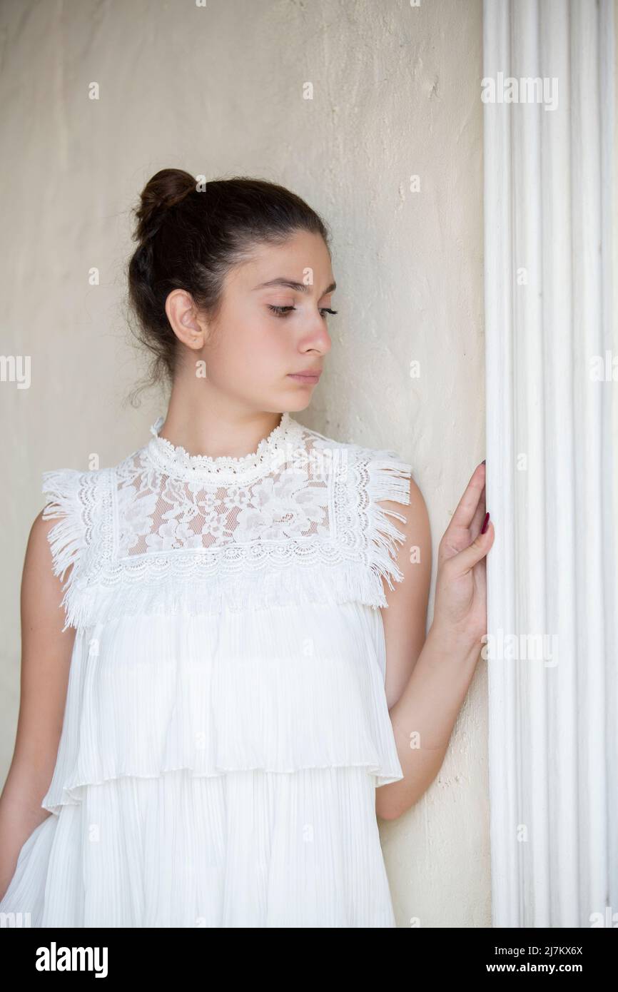 Sad beautiful woman standing indoors Stock Photo - Alamy