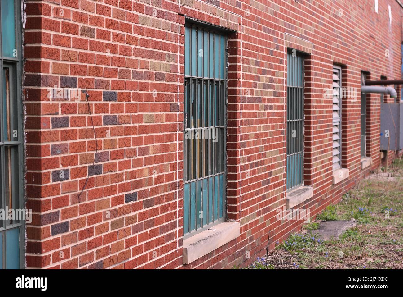 Worn old weathered pane glass window on the wall of an abandoned ...
