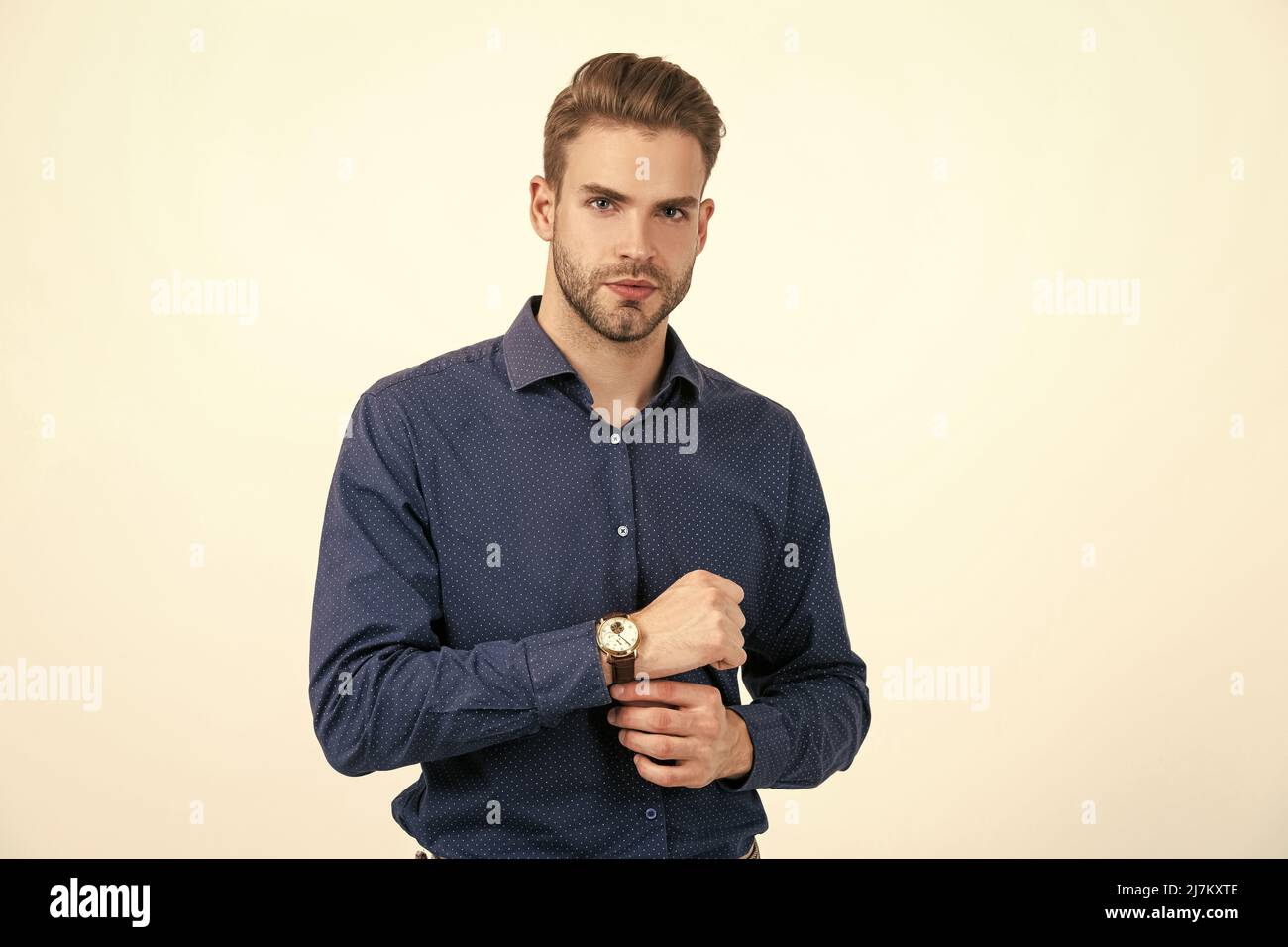 handsome man with groomed hair. businessman with wristwatch. trendy men ...