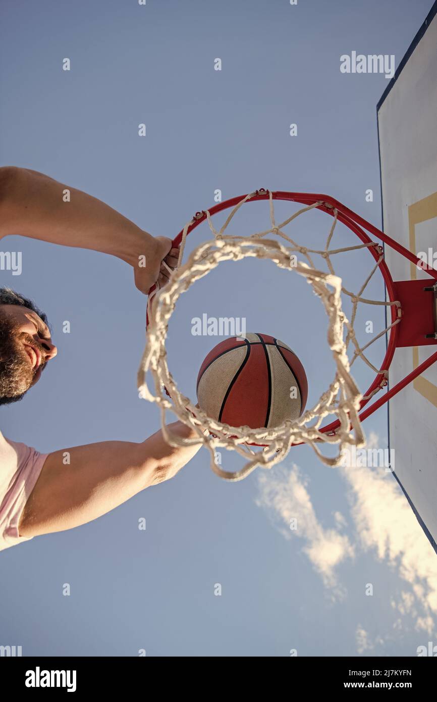 slam dunk in motion. top view. summer activity. man with basketball ...