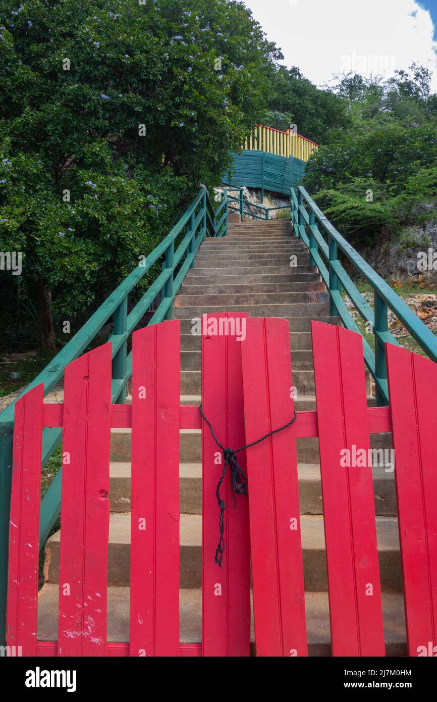Brightly coloured gate and Handrails leading to house at Treasure Beach ...