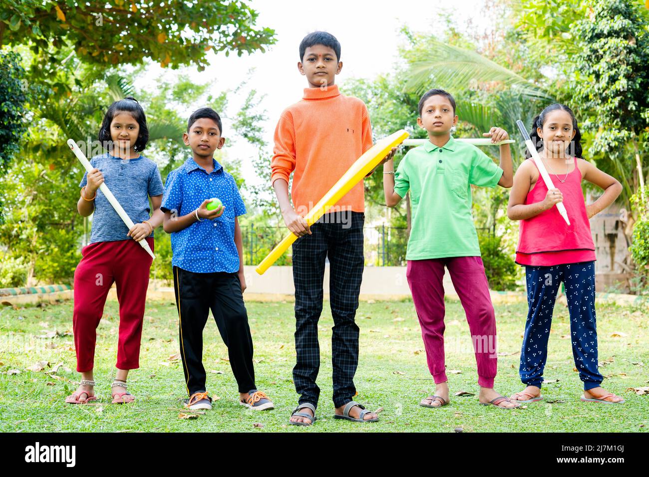 Children with cricket bat and ball hi-res stock photography and images ...