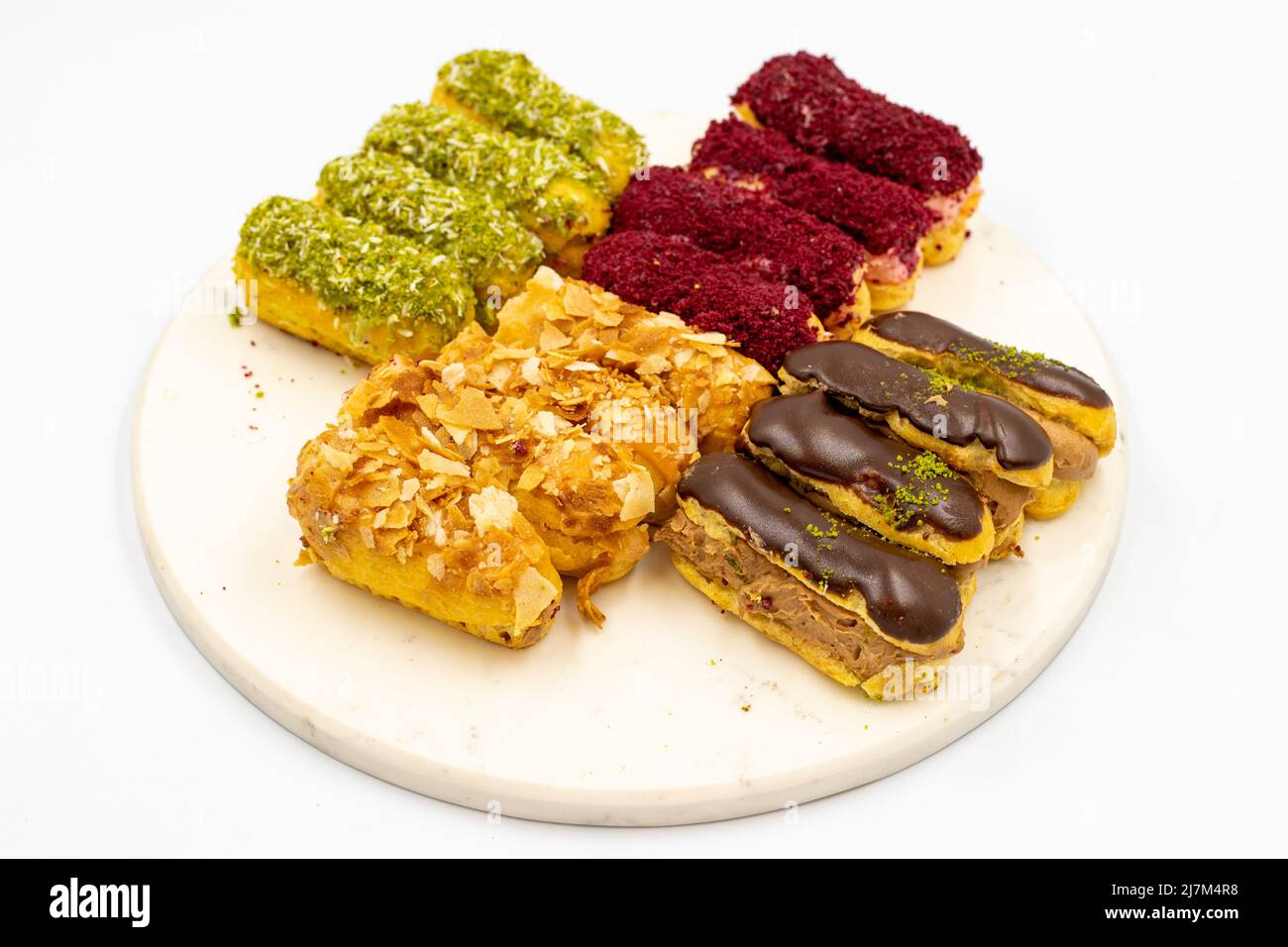 Eclair cake. Assortment of eclairs cake on a white background ...