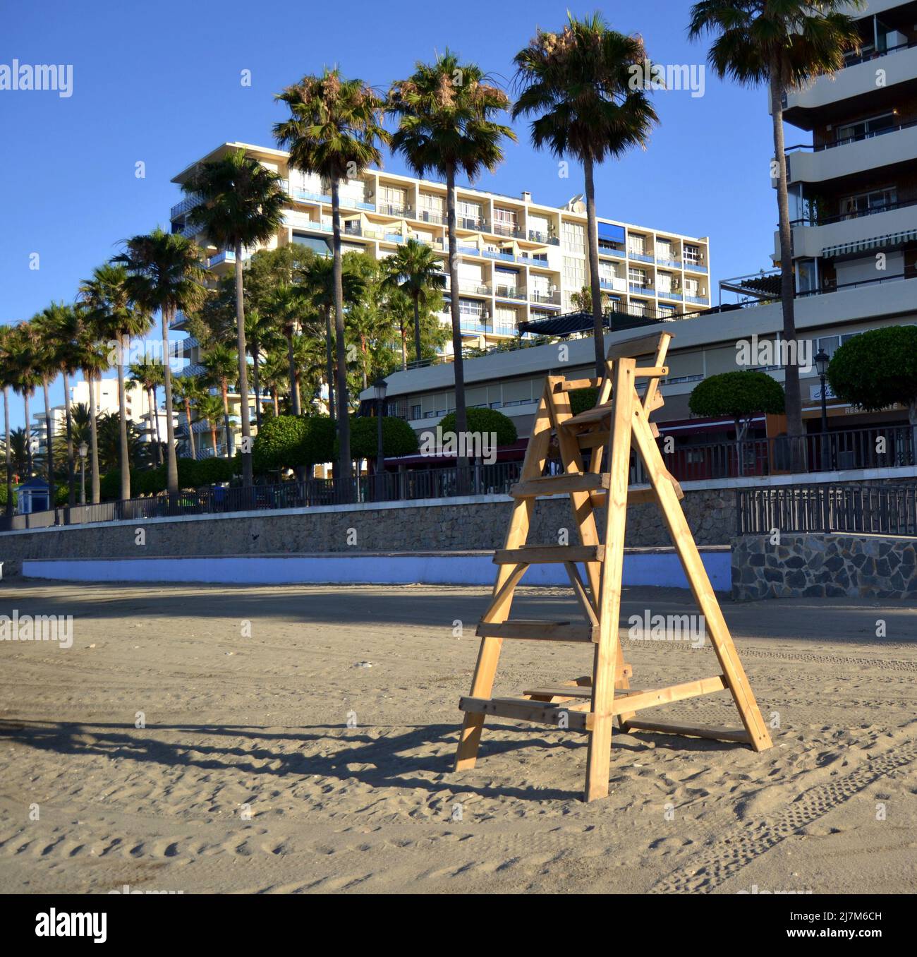 Lonely wooden lifeguard chair on the beach Stock Photo - Alamy
