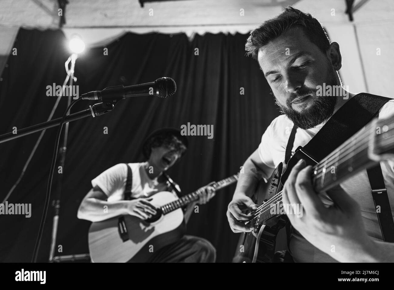 Repetition of rock music band at music studio. Cropped image of ...