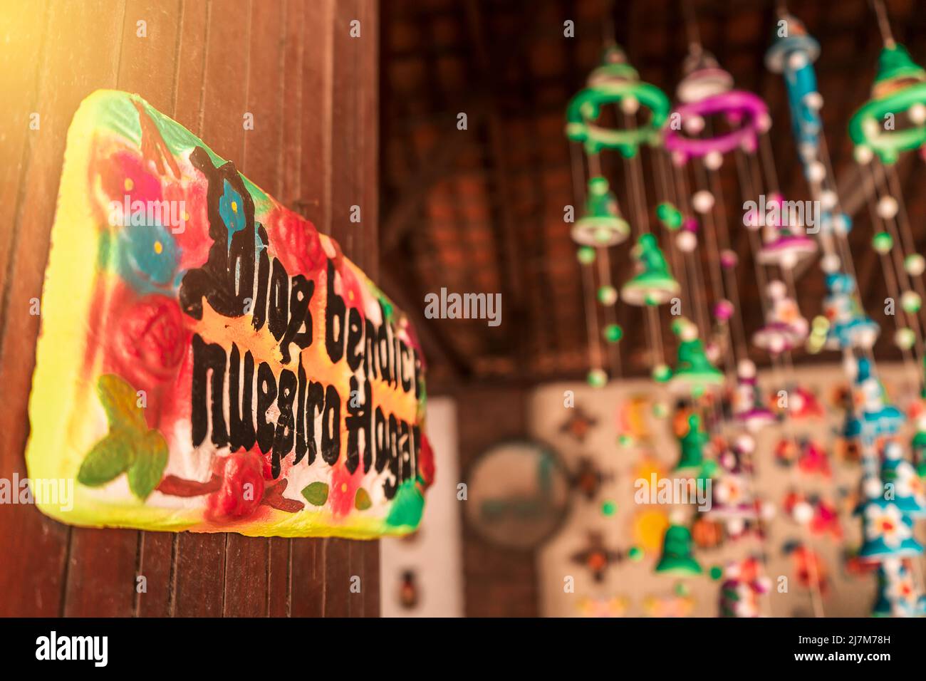 Welcome sign that says in Spanish: God bless our home. The clay ...