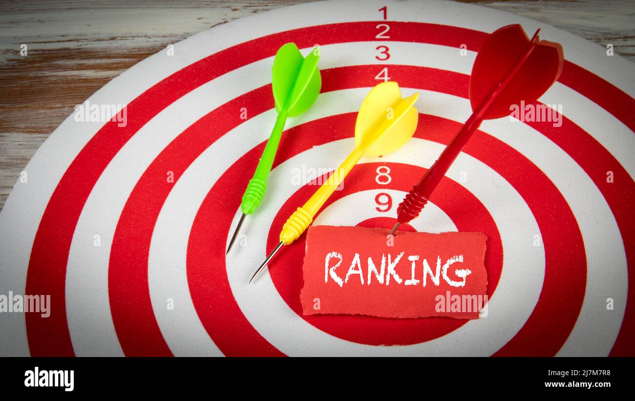 RANKING. Note with text and a dart in the center of the target Stock ...