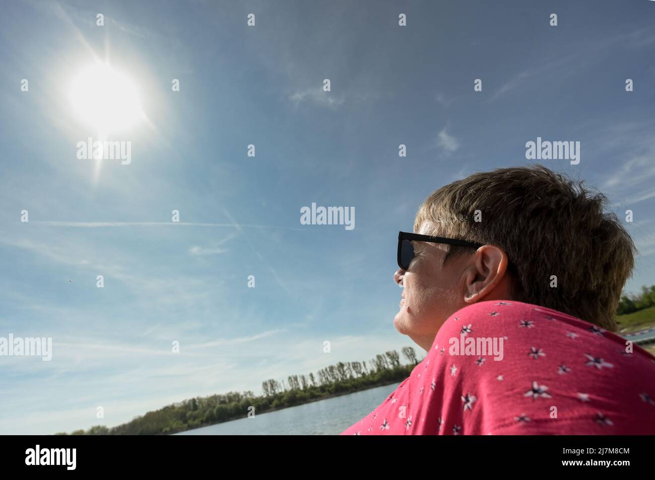 Edderitz, Germany. 10th May, 2022. Kerstin Finze sunbathes at Lake ...