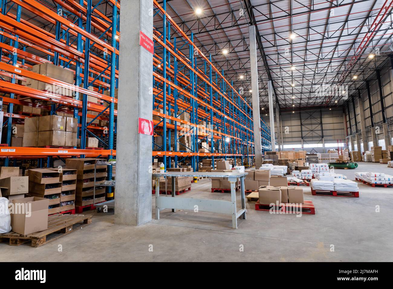 Interior of illuminated storage compartment with stack of cardboard ...