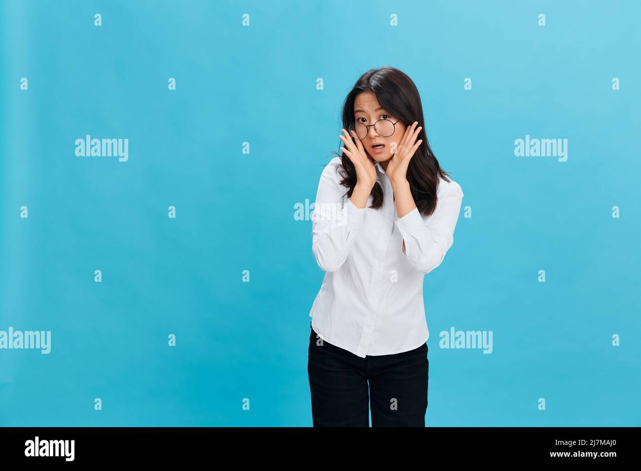 Lovely Asian businesswoman in round glasses classic office dress code ...