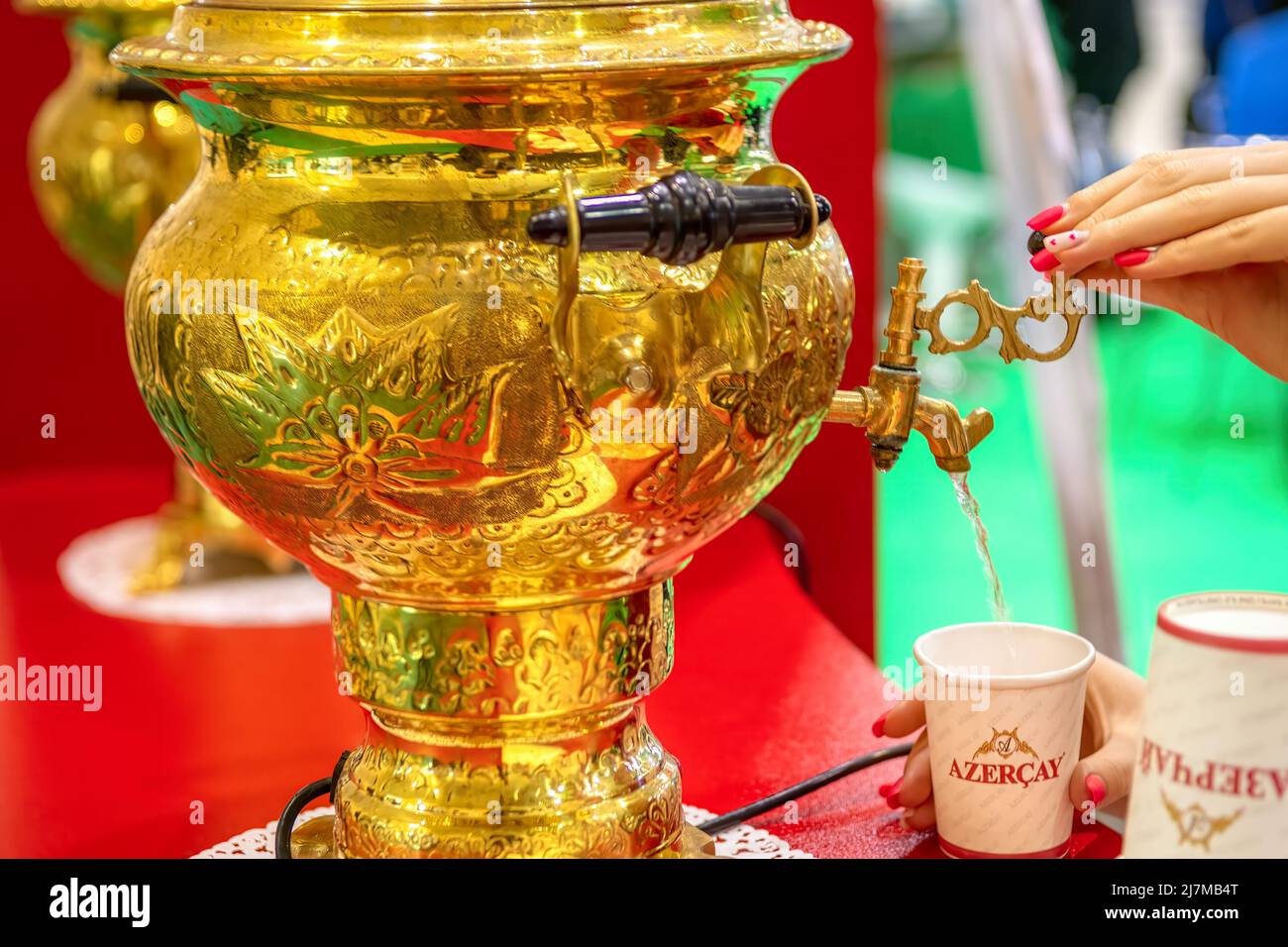 BAKU CITY, AZERBAIJAN - APRIL 13, 2021: Azerbaijani tea Azercay. Girl ...