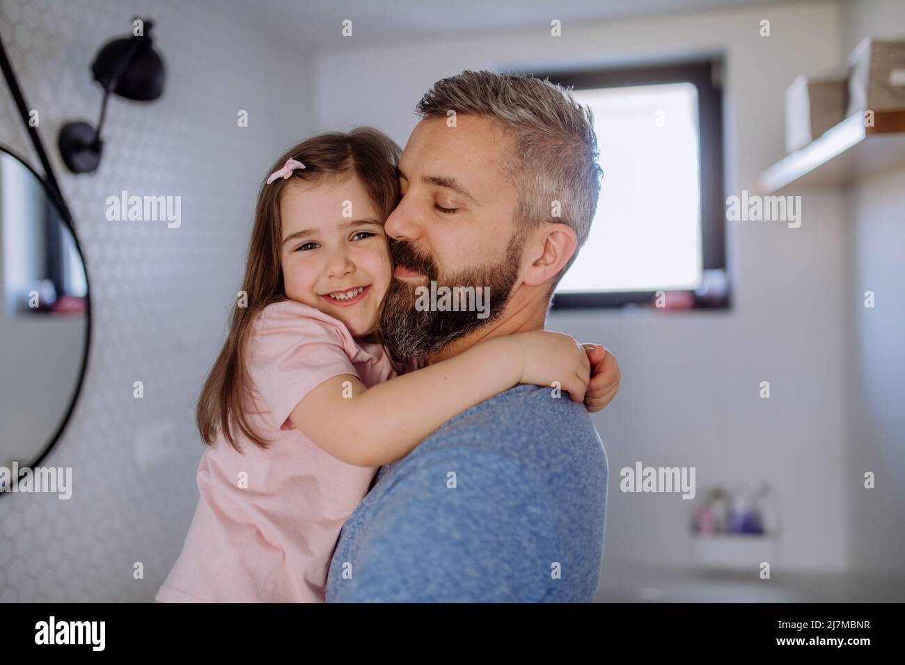 Happy father hugging his little daughter in bathroom Stock Photo - Alamy