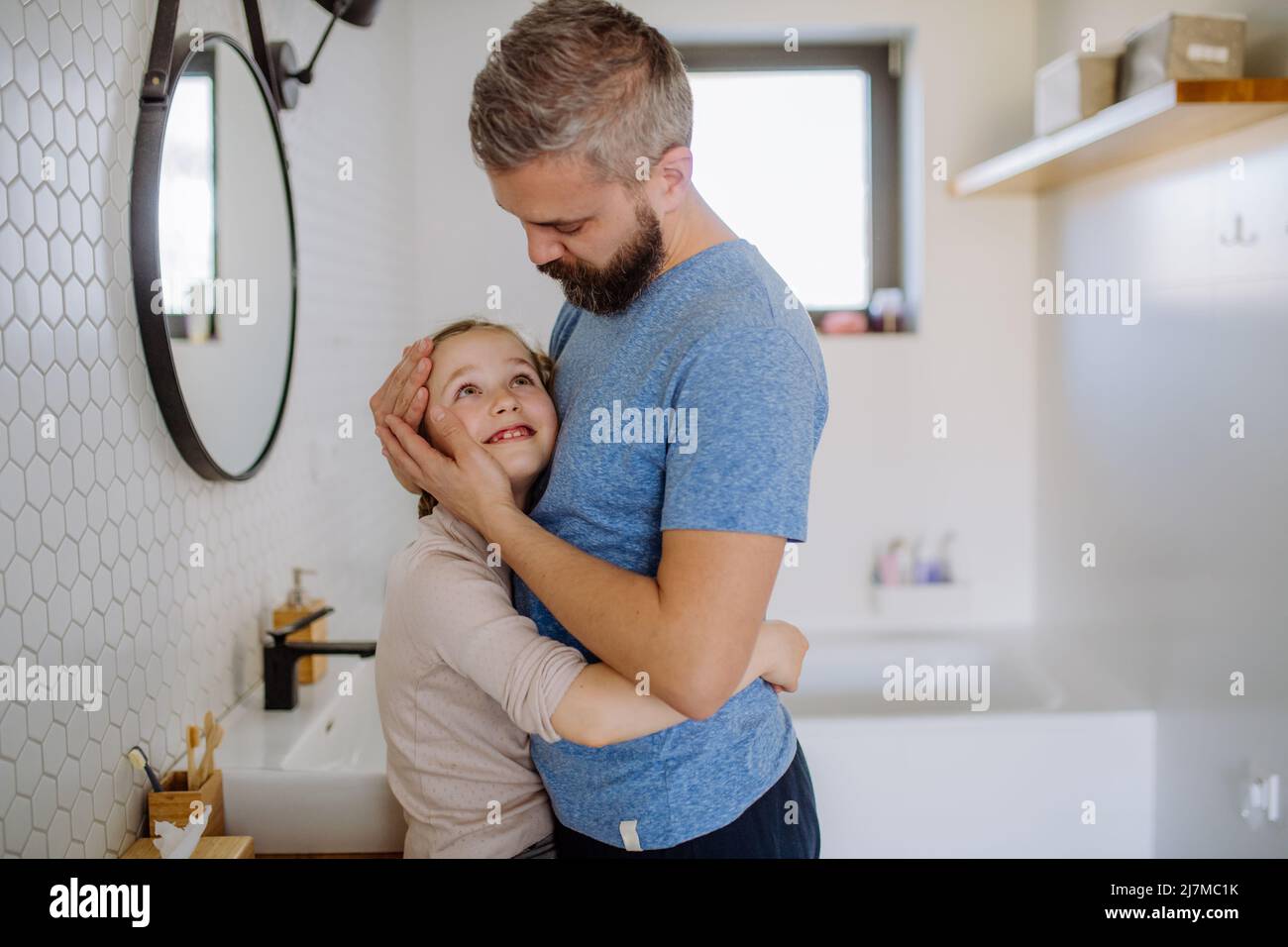 Happy father hugging his little daughter in bathroom Stock Photo - Alamy