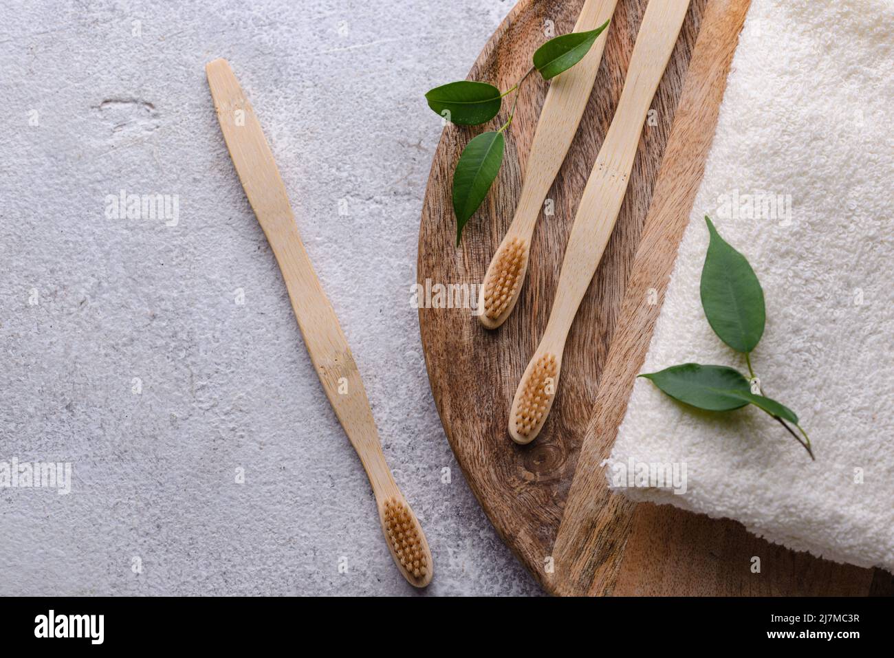 Bamboo toothbrush, zero waste care products Stock Photo - Alamy
