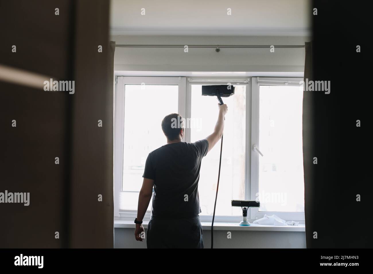 washing and cleaning window at home. Housework and housekeeping, home ...