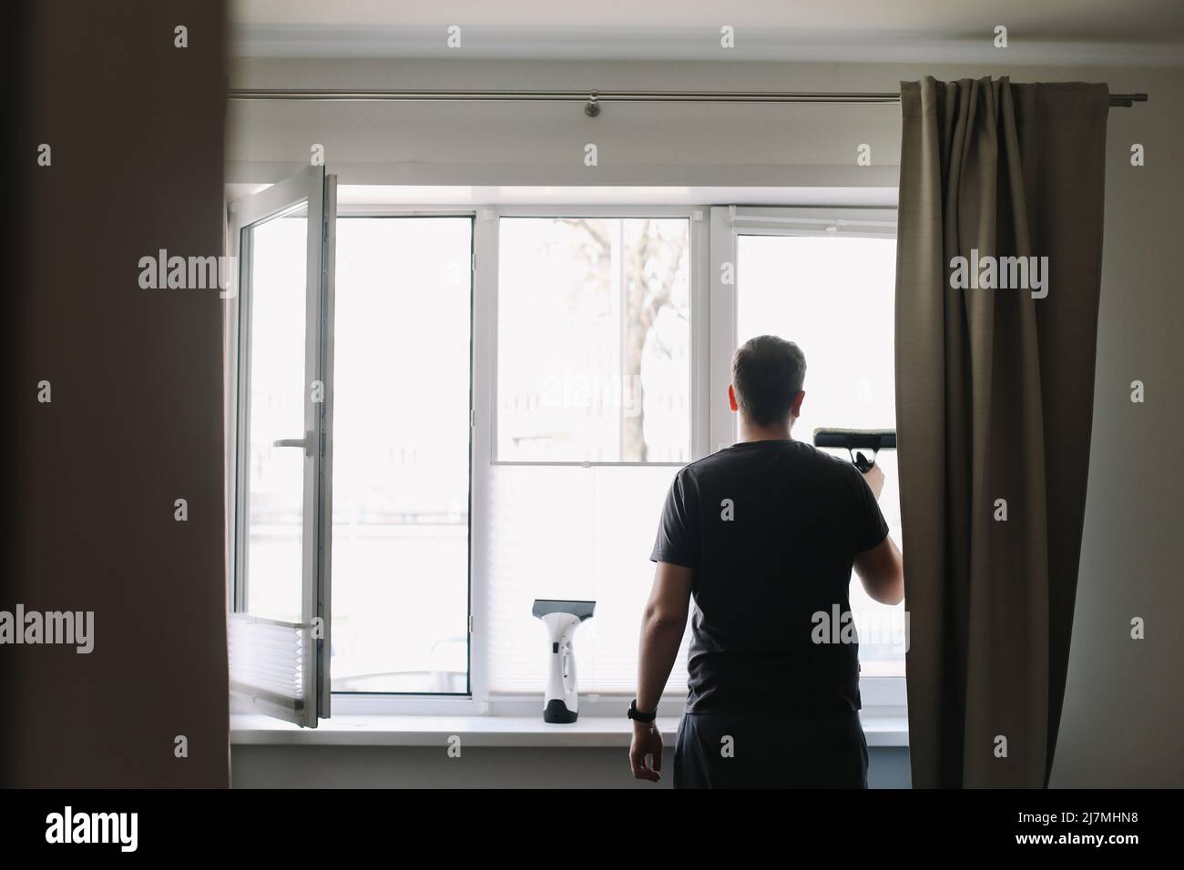 washing and cleaning window at home. Housework and housekeeping, home ...