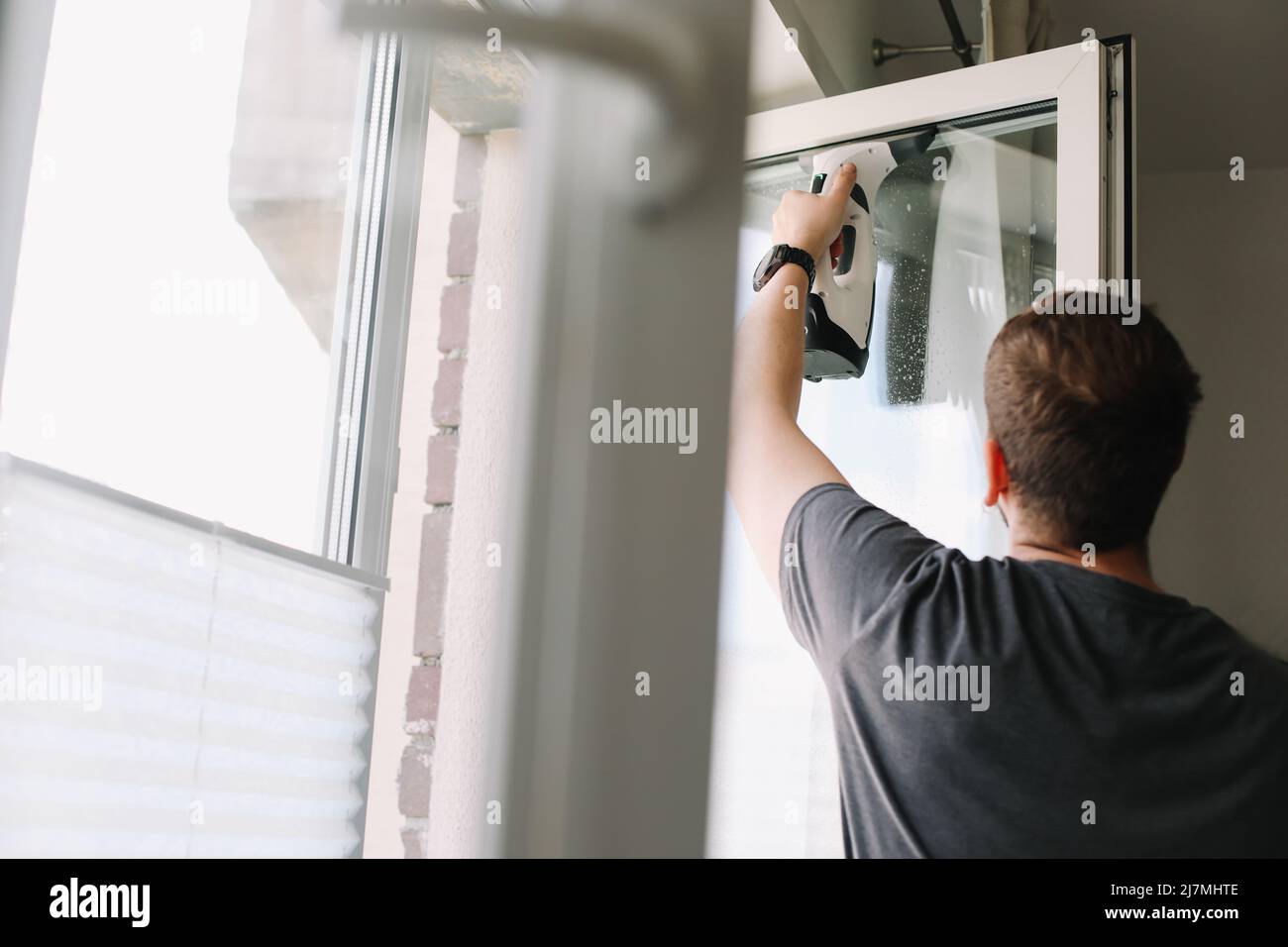 washing and cleaning window at home. Housework and housekeeping, home ...