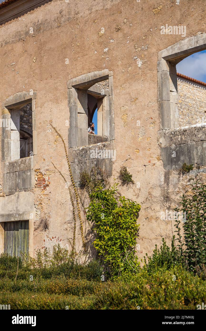 View of an inner wall with a window from the monastery castle in Tomar ...
