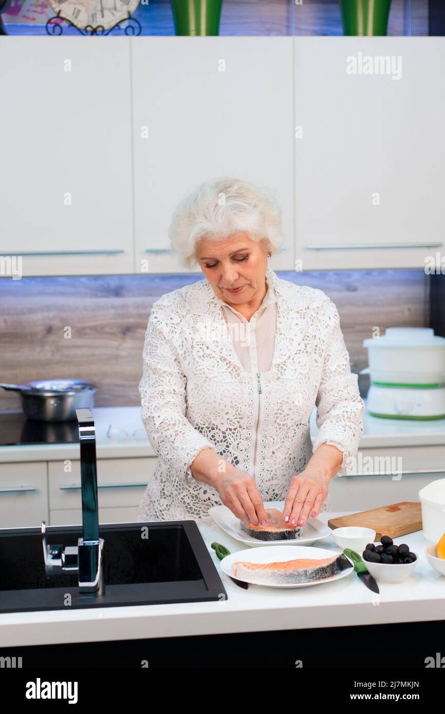 Mature woman cooks hi-res stock photography and images - Alamy