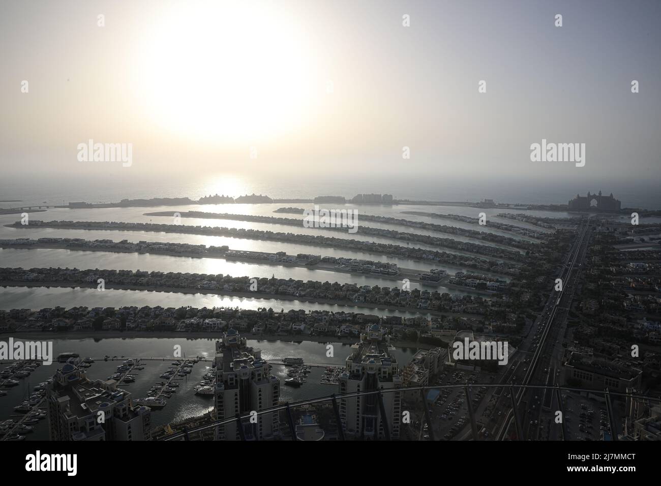 View over the Palm, Dubai with blaring sun Stock Photo - Alamy