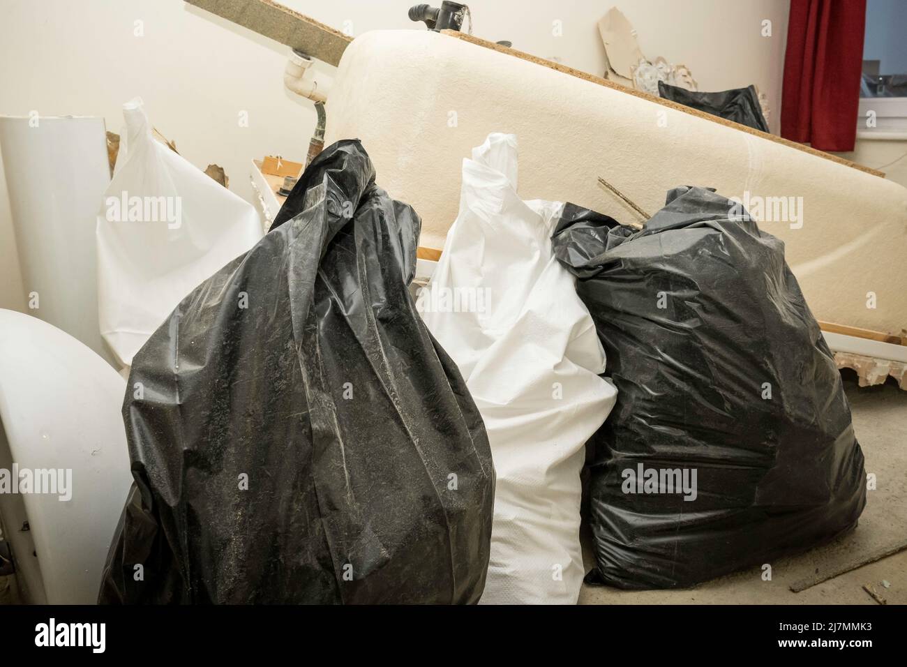 A waste rubbish bag and bath in the living room Stock Photo - Alamy
