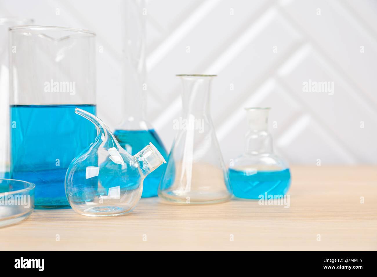 Laboratory glassware with test tubes. flasks, dropper, petri dishes ...