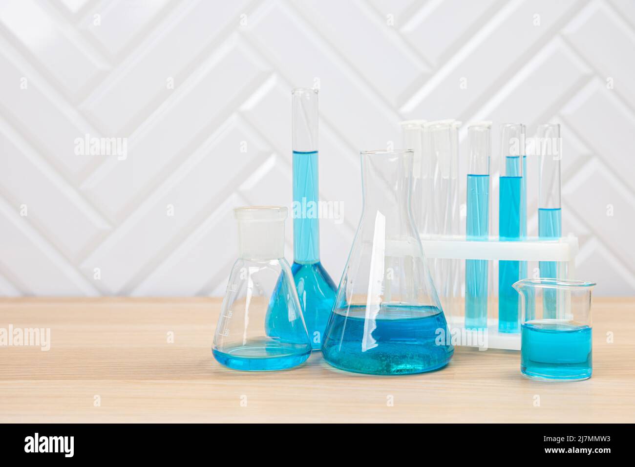Laboratory glassware with test tubes. flasks, dropper, petri dishes ...