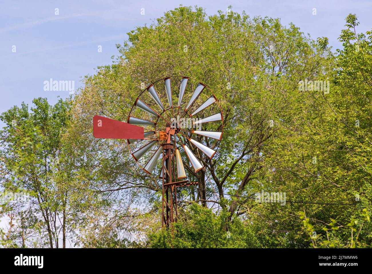 Rusty Old Style Wind Turbine Near Woods Stock Photo - Alamy