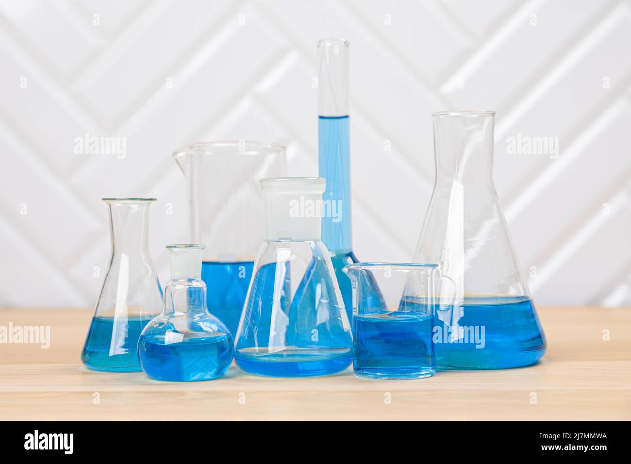 Laboratory glassware with test tubes. flasks, dropper, petri dishes ...