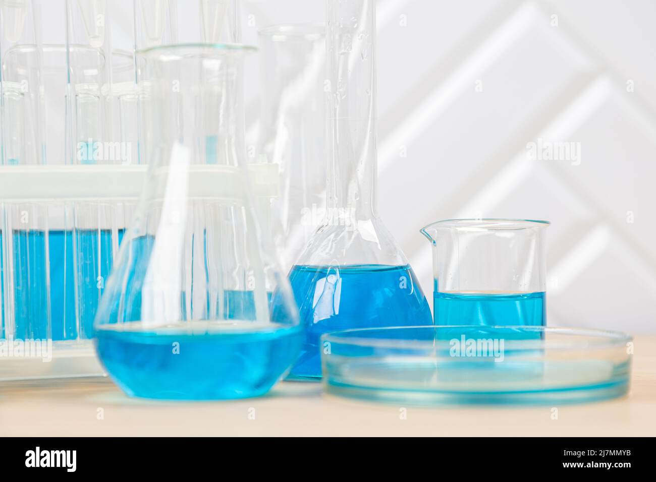 Laboratory glassware with test tubes. flasks, dropper, petri dishes ...