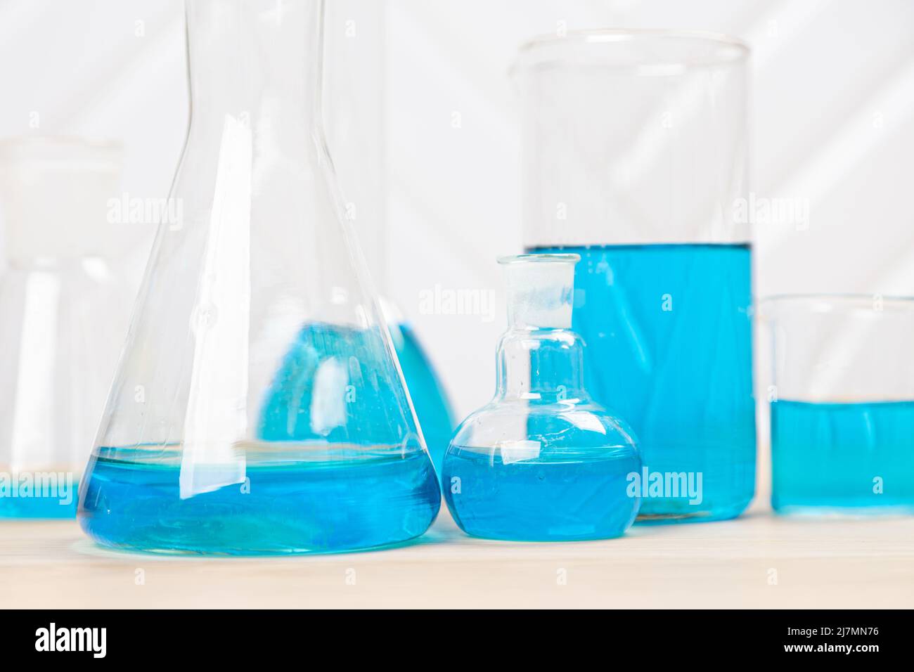 Laboratory glassware with test tubes. flasks, dropper, petri dishes ...