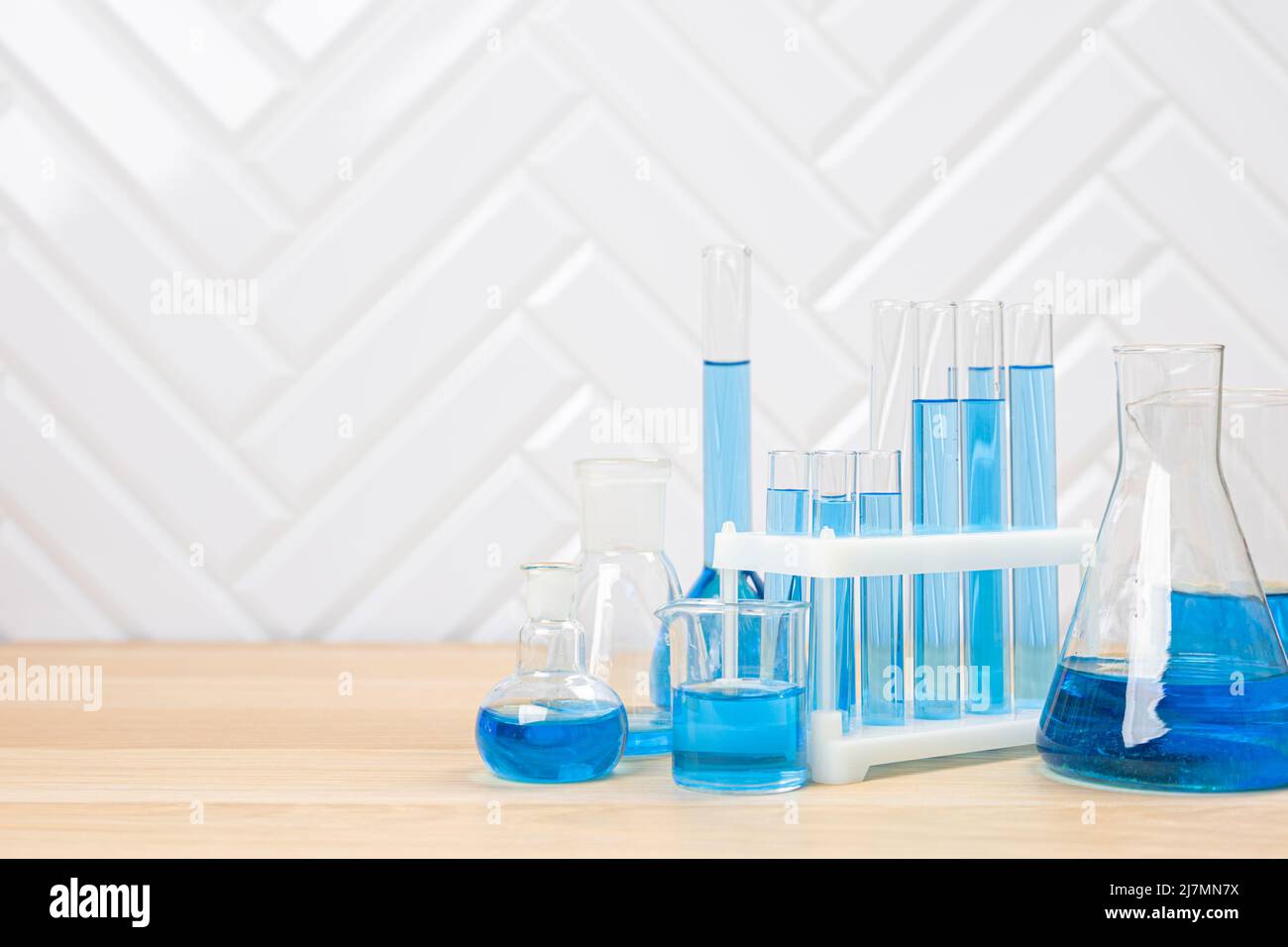 Laboratory glassware with test tubes. flasks, dropper, petri dishes ...